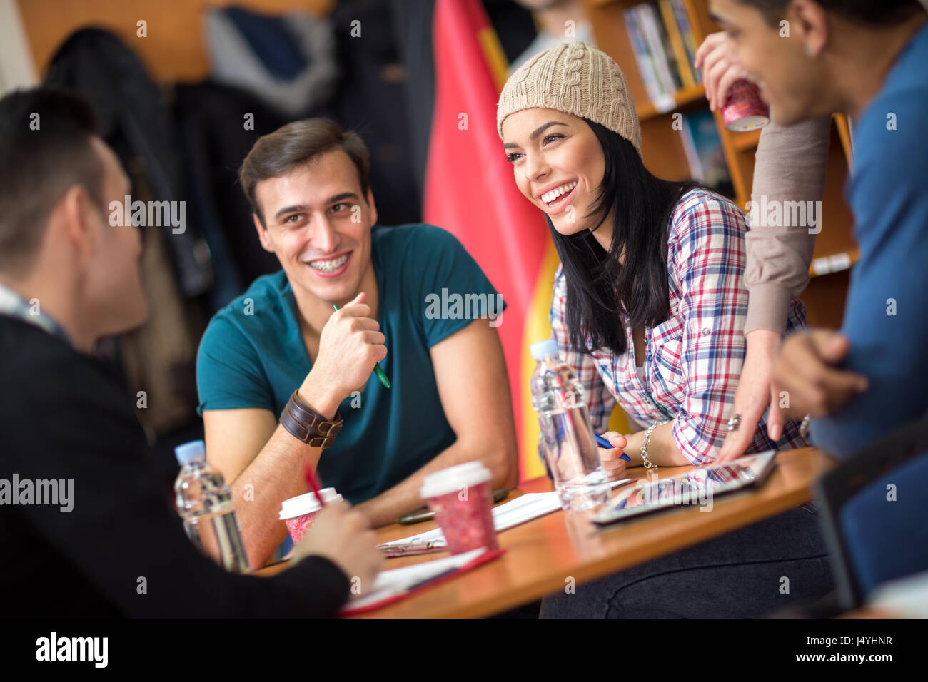 Group of young happy students socializing and having fun Stock Photo ...