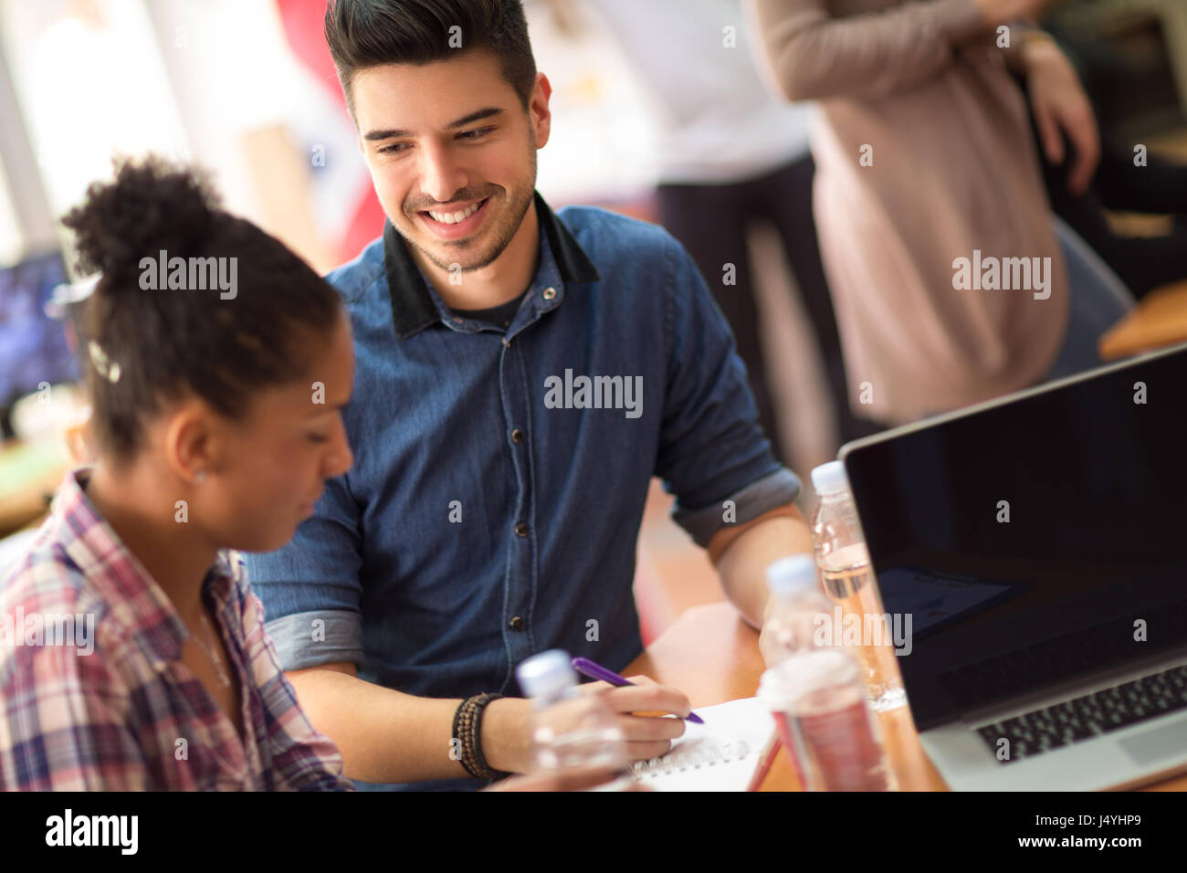 Young studying friends doing homework task for lecture Stock Photo - Alamy
