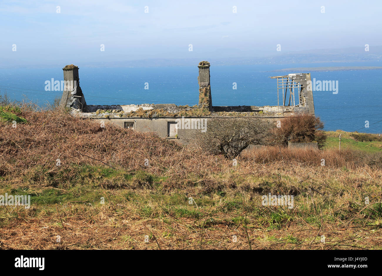 Abandoned ruined farmhouse building on west coast of Cape Clear Island ...