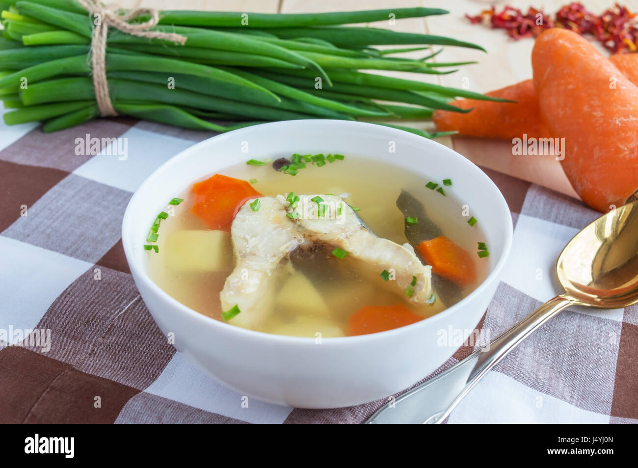 Russian national traditional fish soup in a white bowl Stock Photo - Alamy