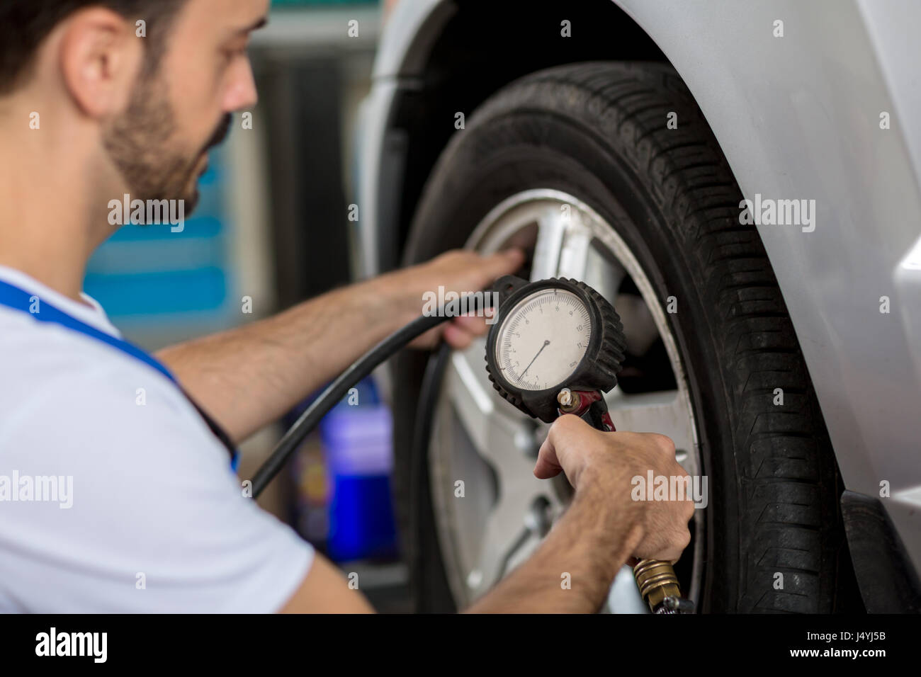 check holding pressure gauge for car tyre pressure measurement Stock ...