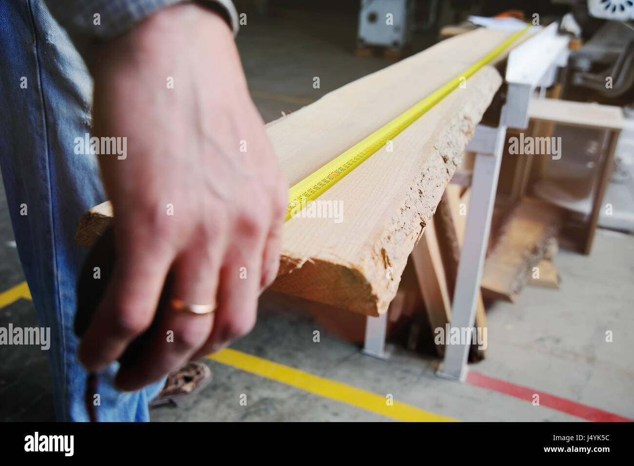 Carpenter works with wood in carpentry workshop Stock Photo - Alamy