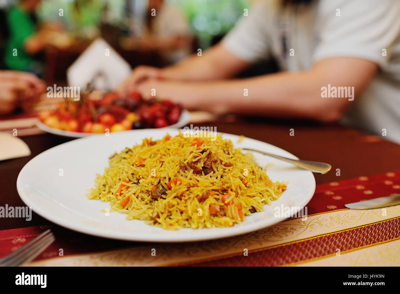 pilaf with meat on the table Stock Photo - Alamy