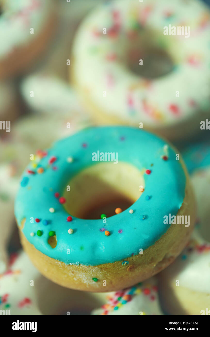 Delicious pretzels with blue glaze Stock Photo - Alamy