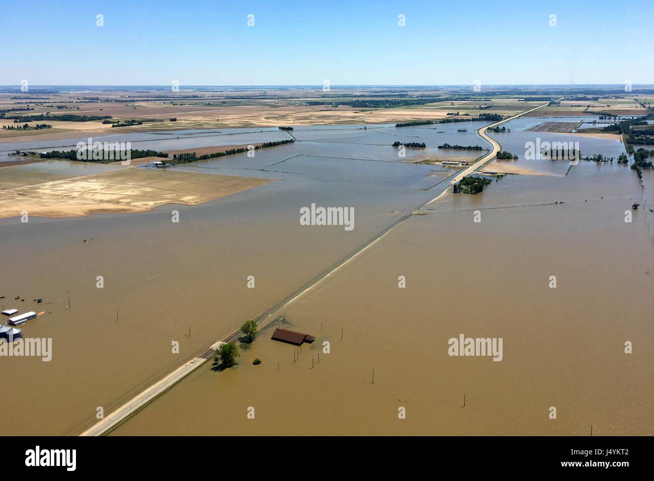 Roads and fields surrounded by floodwaters after a levee failed along ...