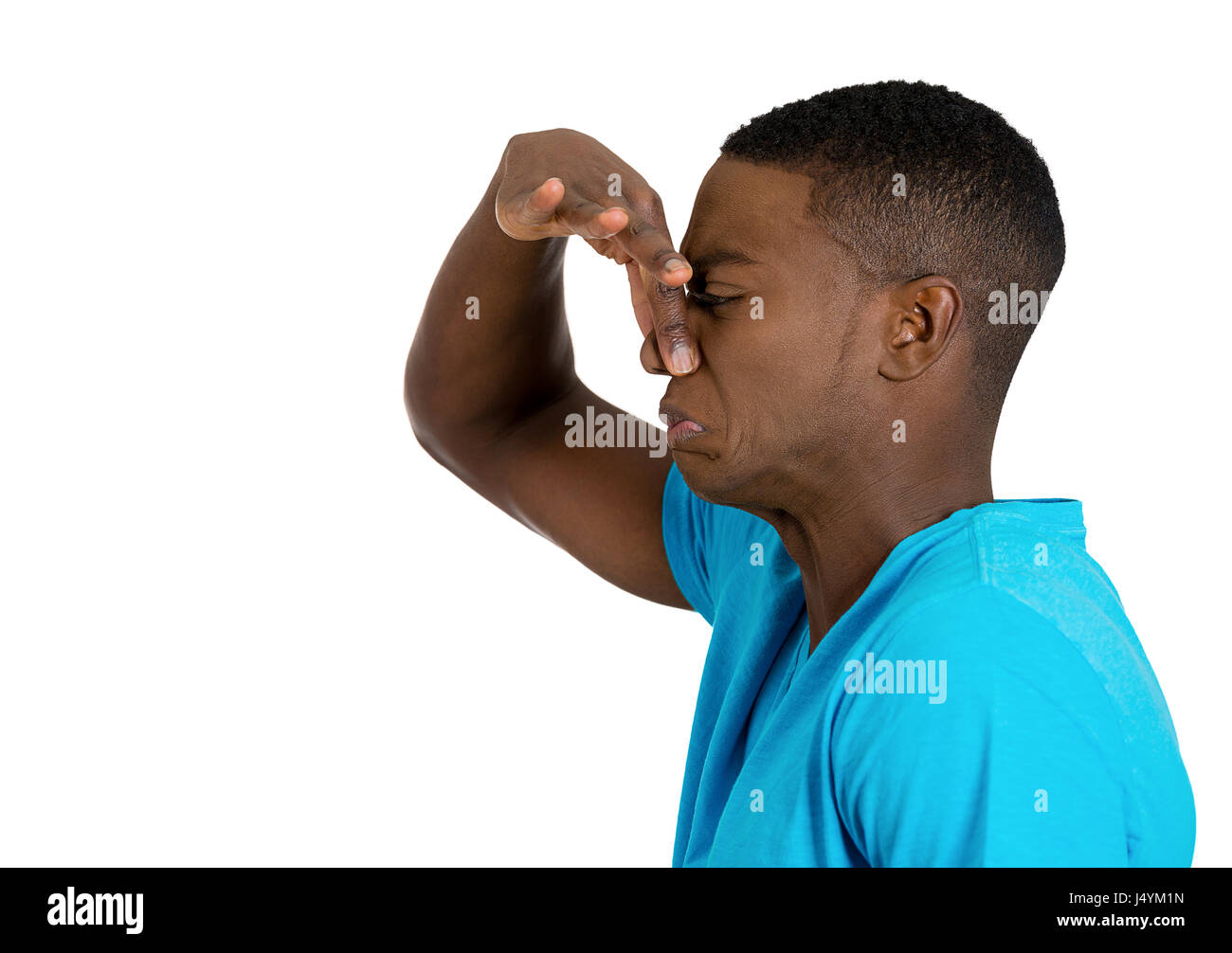 Closeup side view profile portrait young man disgust on face, pinches ...