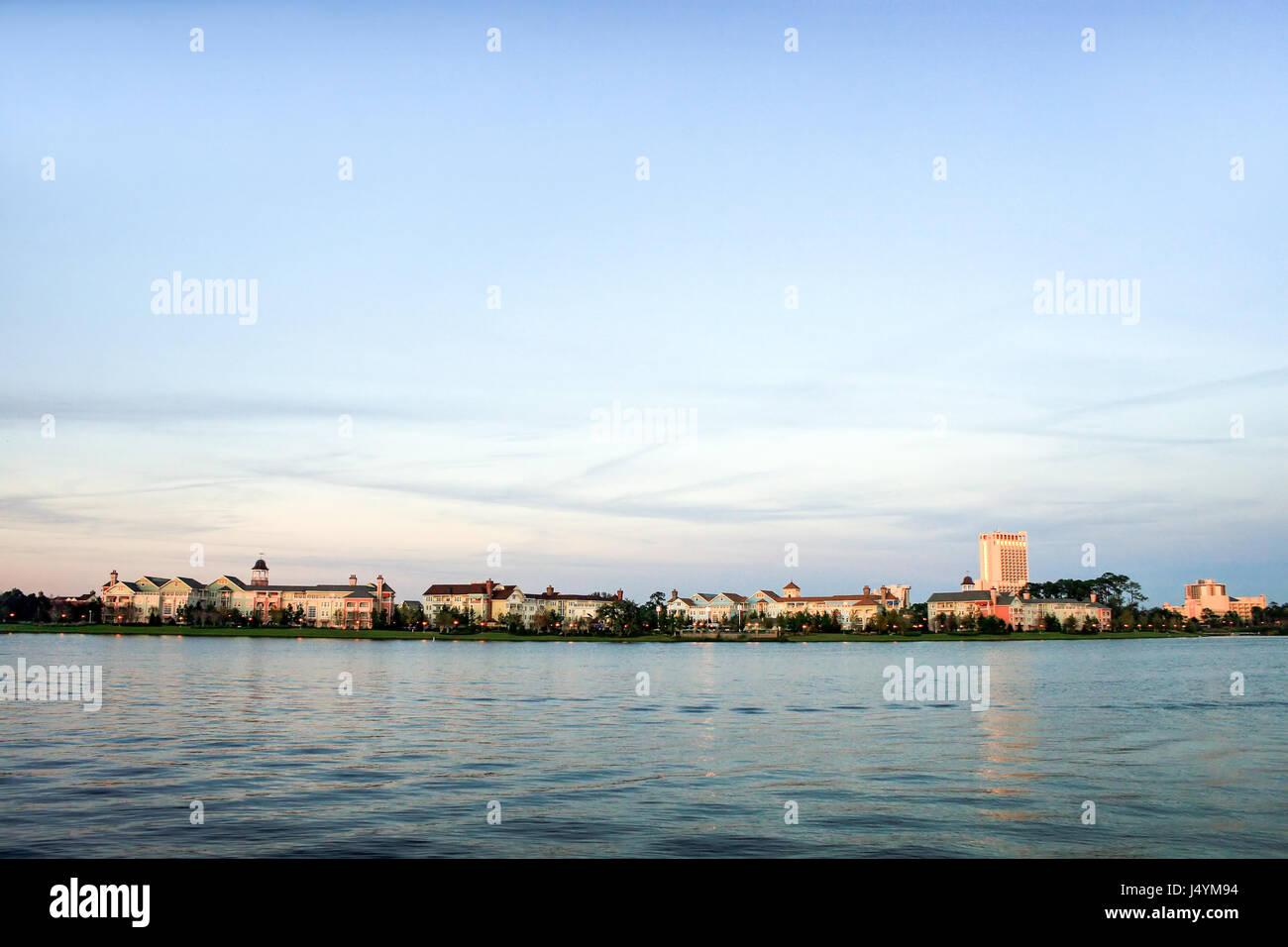 Buildings on the horizon of a lake Stock Photo - Alamy