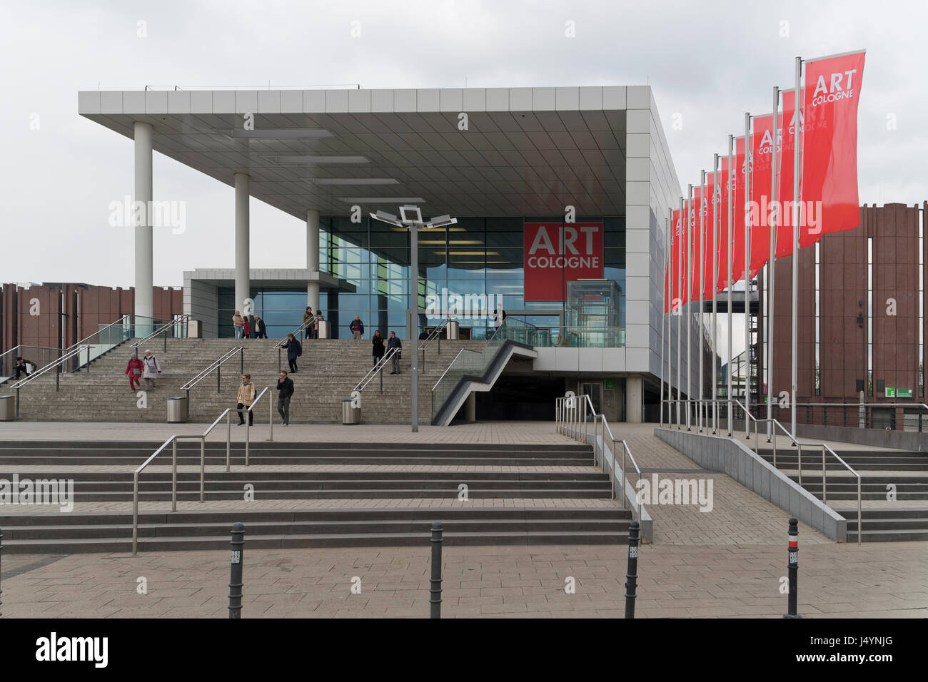 The entrance to Art Cologne with people at the stairs. The modern ...