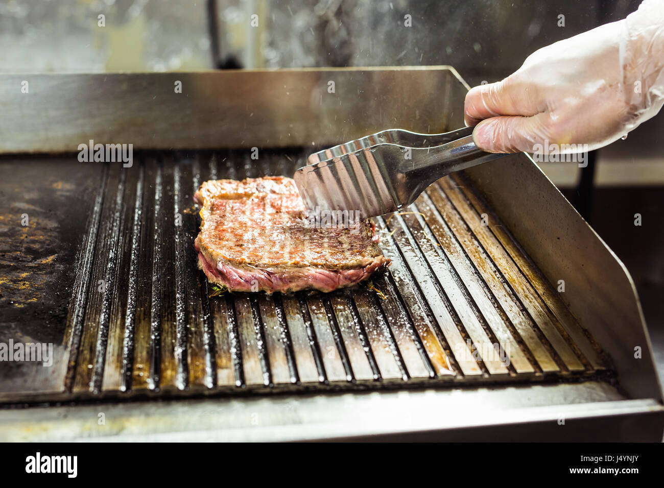 closeup of a steak on grill Stock Photo - Alamy