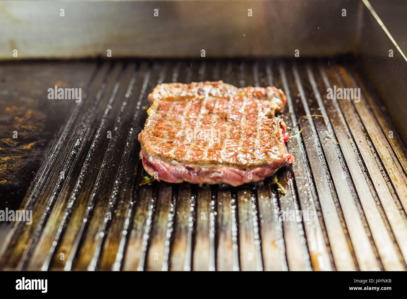 closeup of a steak on grill Stock Photo - Alamy