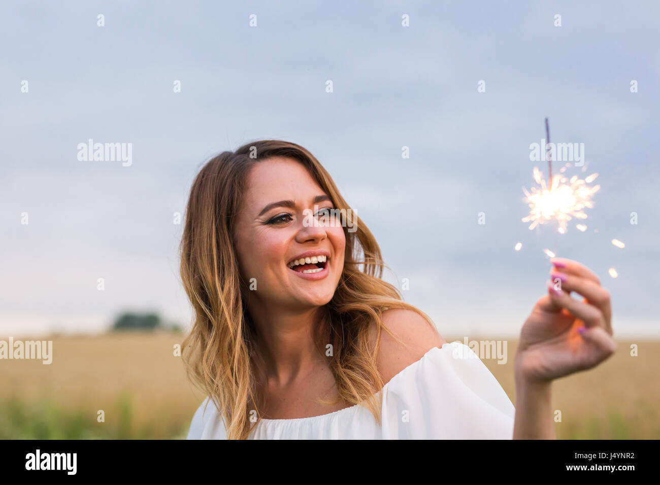 Girl with sparkler Stock Photo - Alamy