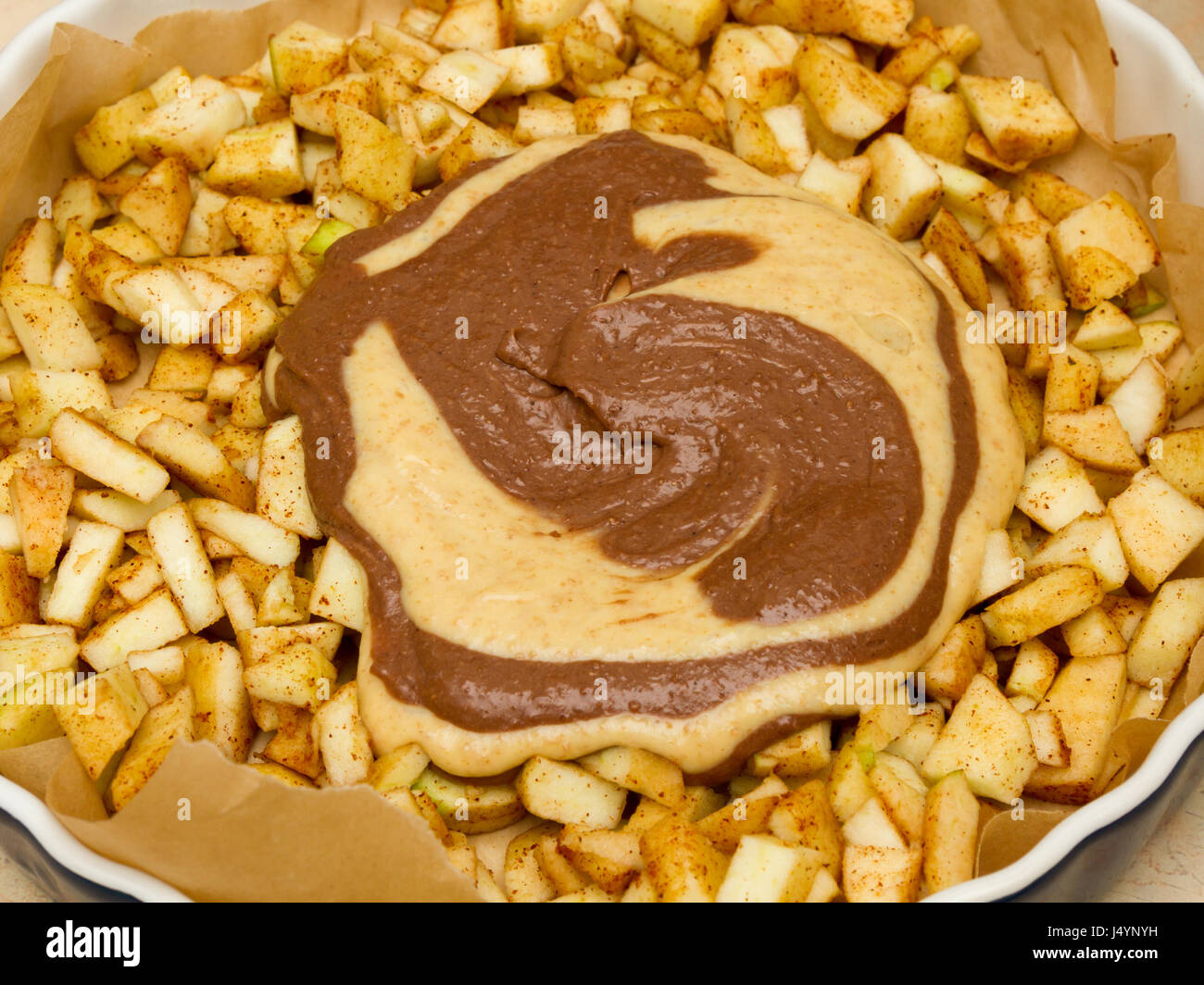 Pouring cinnamon powder into apple filling. Making Filo Pastry Topped ...