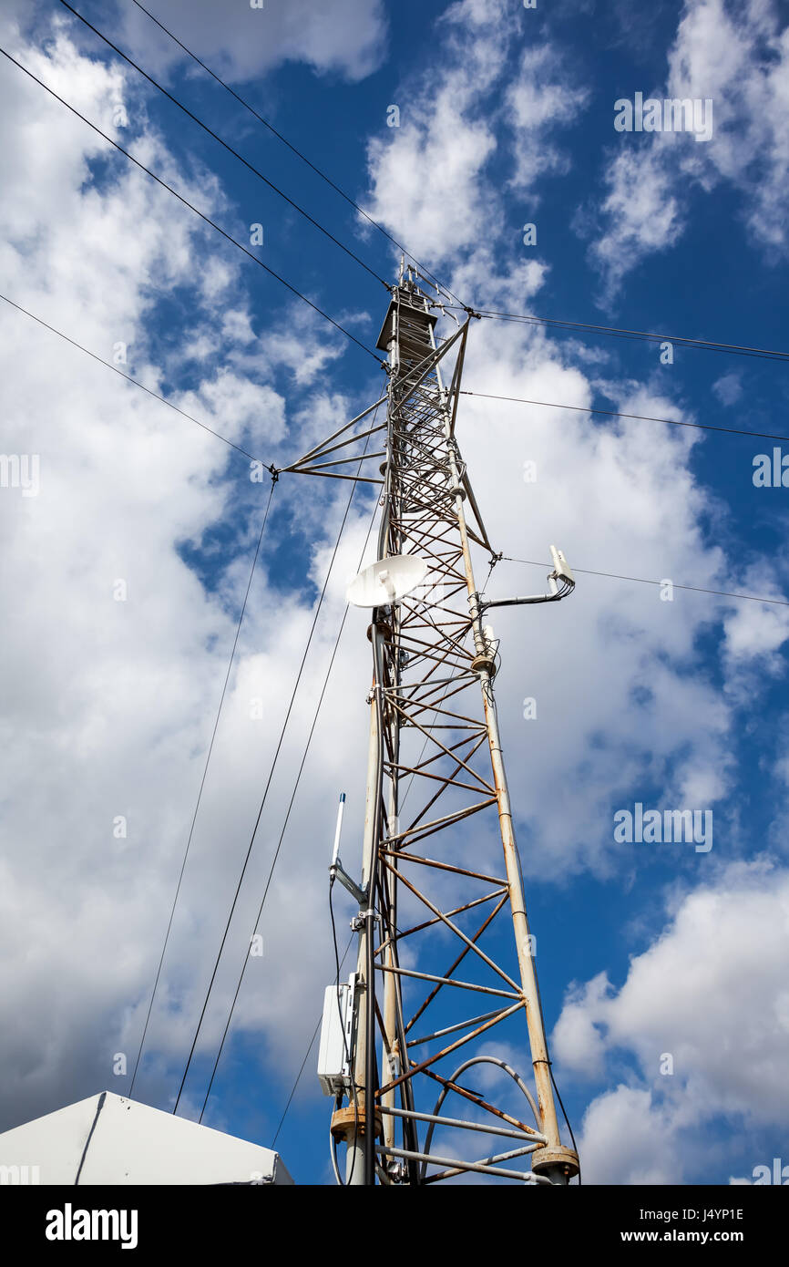 On a tall building there is a radio mast Stock Photo - Alamy