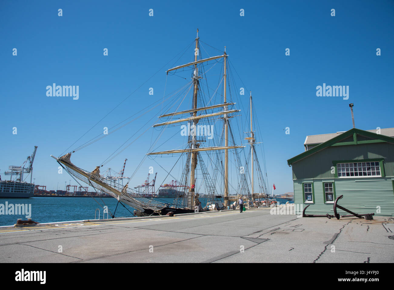 SS Leeuwin II tall ship with dockside warehouses and commercial port in ...