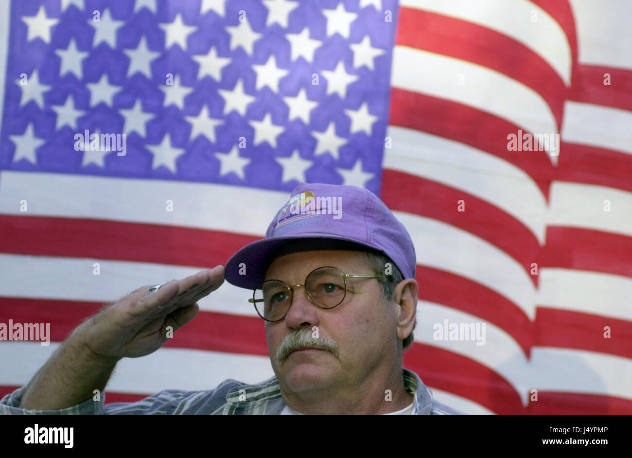 Army veteran Phillip Purtlebaugh of Bloomington, Indiana salutes the ...