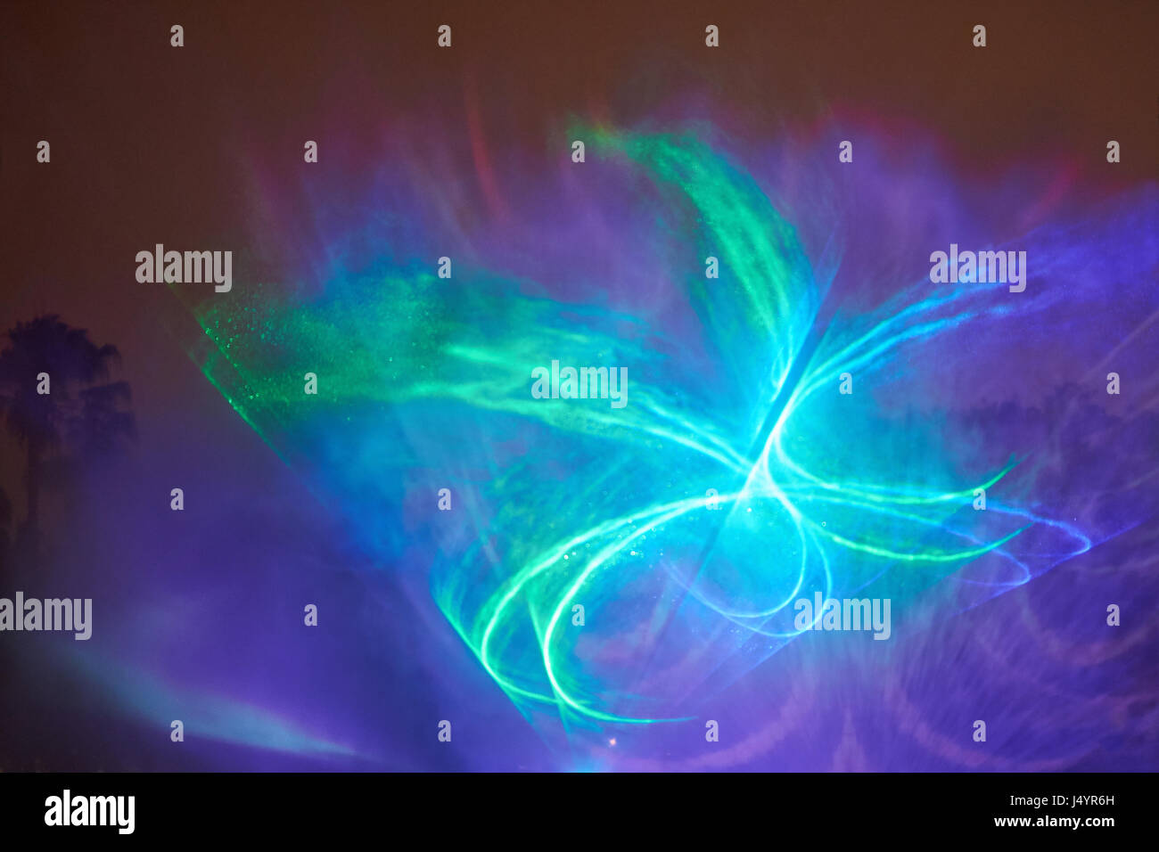 Colorful laser illumination show at night. Abstract blue light ...