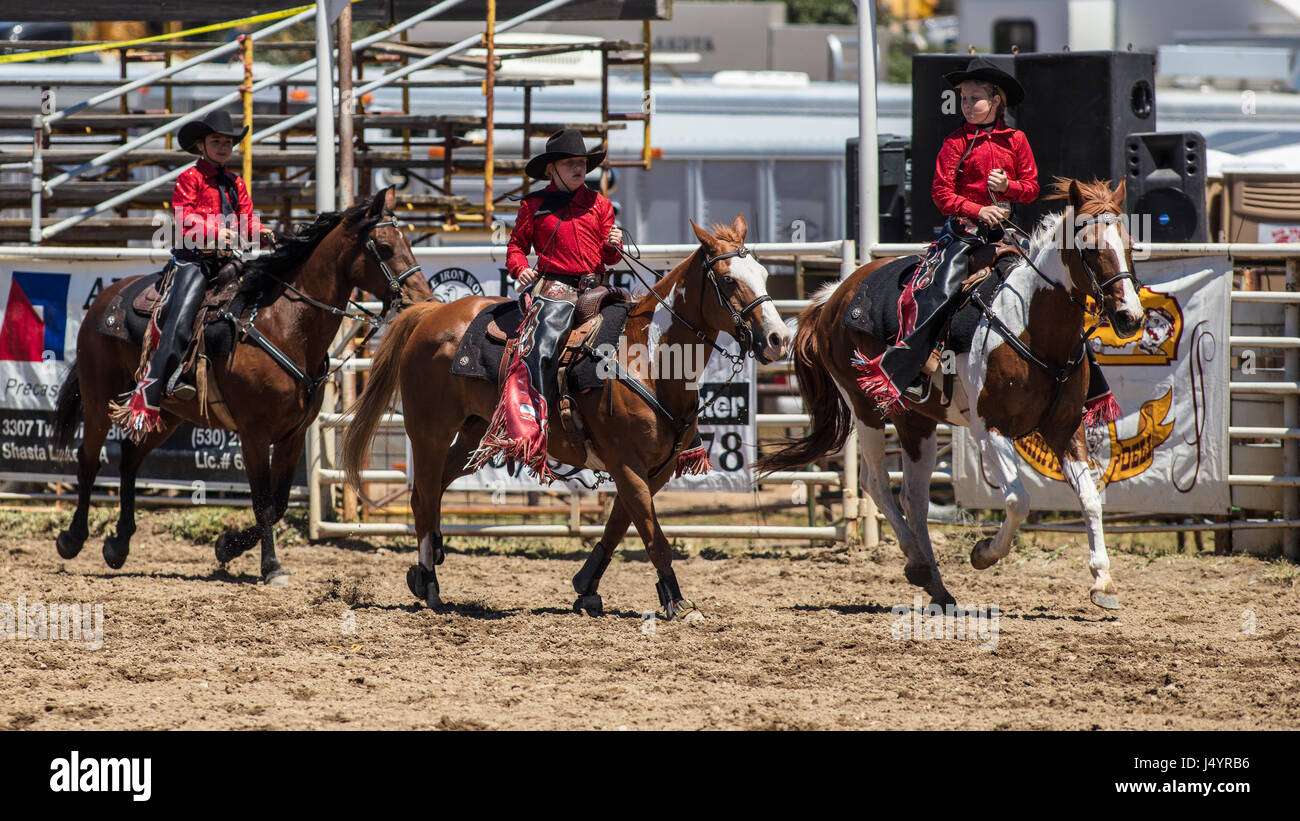 Drill team cowgirl rides in the arena at the Cottonwood Rodeo in ...