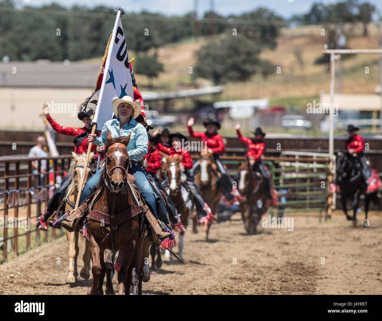 Drill team cowgirl rides in the arena at the Cottonwood Rodeo in ...