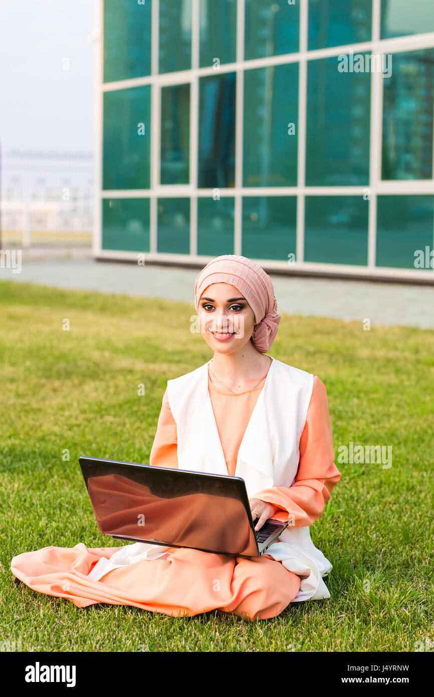 Young Muslim Girl using laptop Stock Photo - Alamy