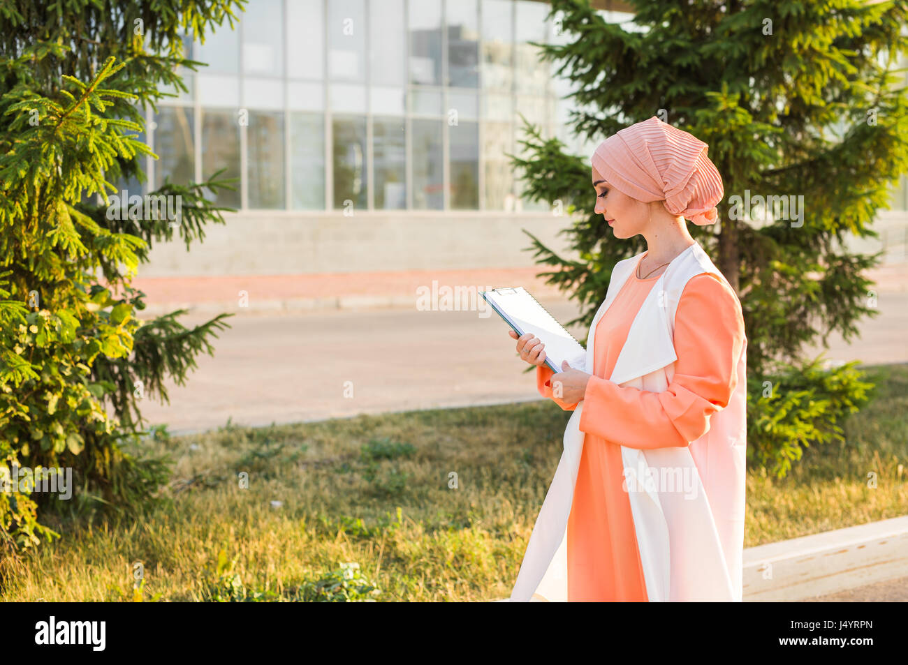 Muslim woman holding document hi-res stock photography and images - Alamy