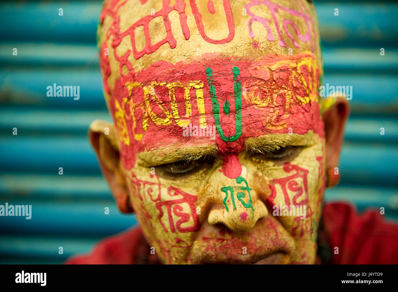 Priest writing radhe krishna on face by sandalwood paste, uttar pradesh ...