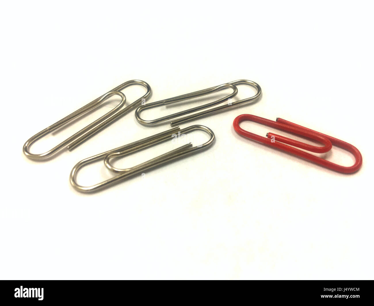Paper clip on table Cut Out Stock Images & Pictures - Alamy