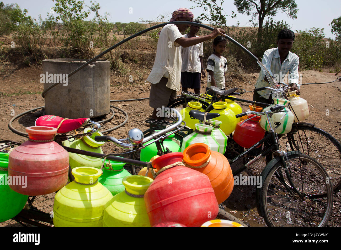 Man filling water in pot hi-res stock photography and images - Alamy