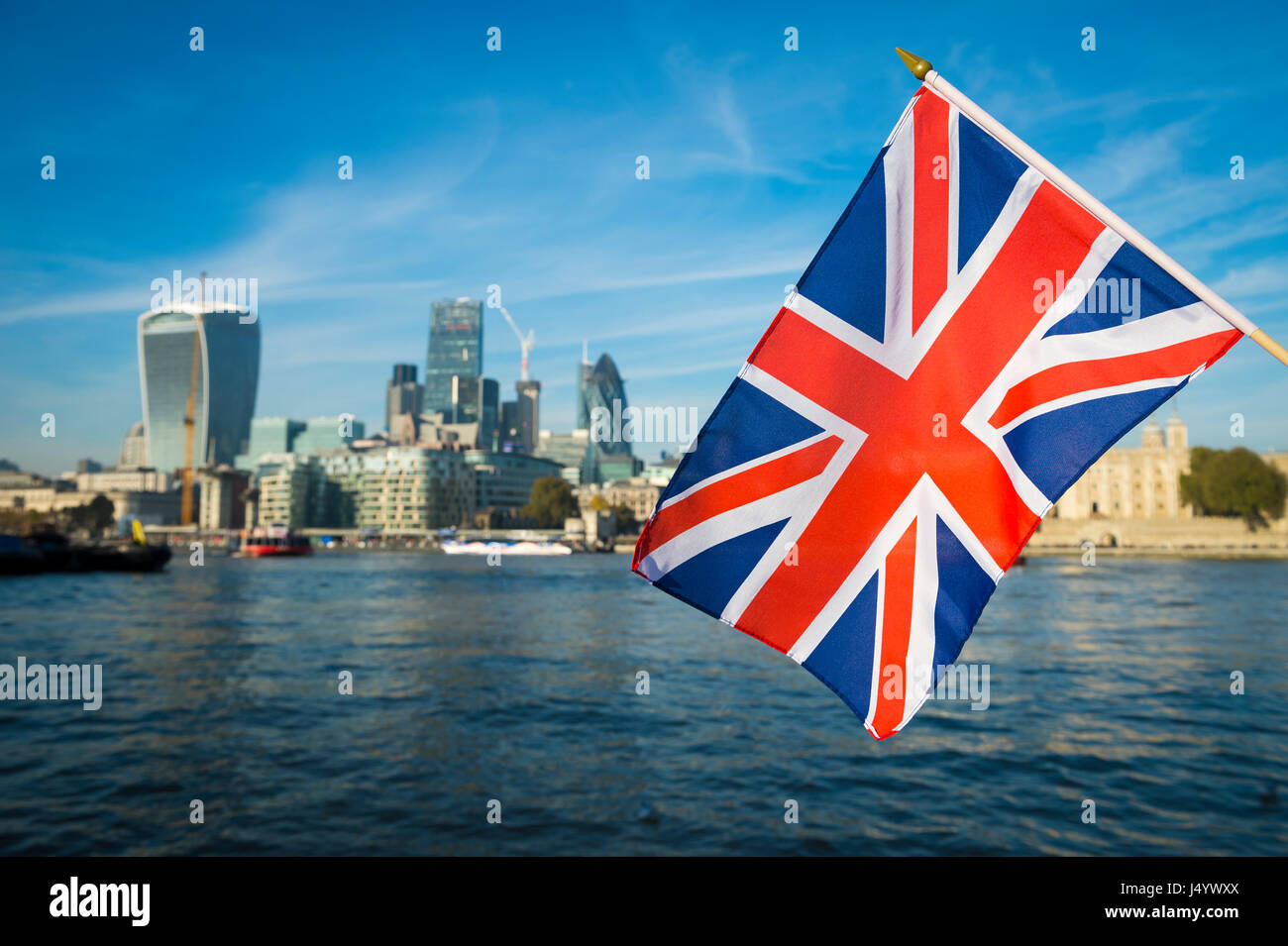 Union Jack (United Kingdom flag) flying over the London skyline of the ...
