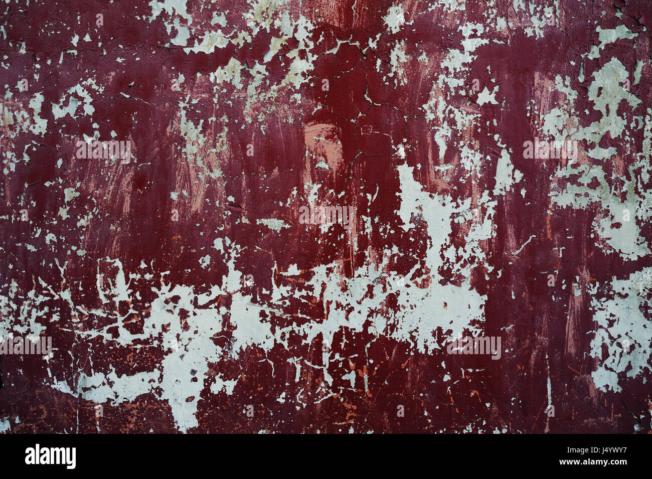texture of red wall with paint peeling off Stock Photo - Alamy