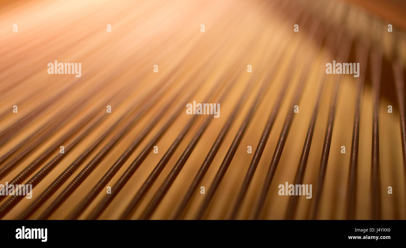 Grand piano strings, steel wire core wound with copper wire Stock Photo ...
