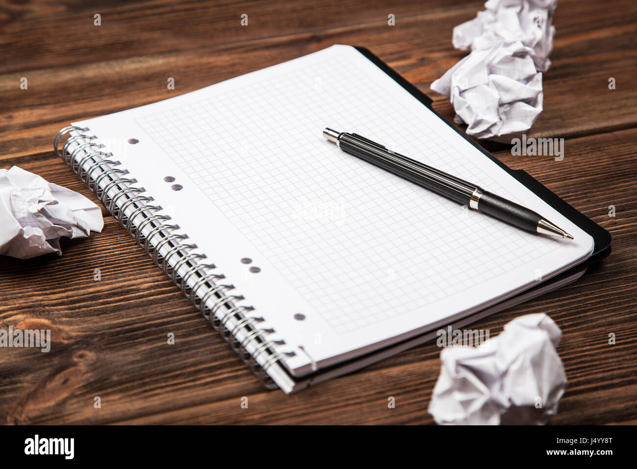 Creative block concept - blank notepad and crumpled paper Stock Photo ...