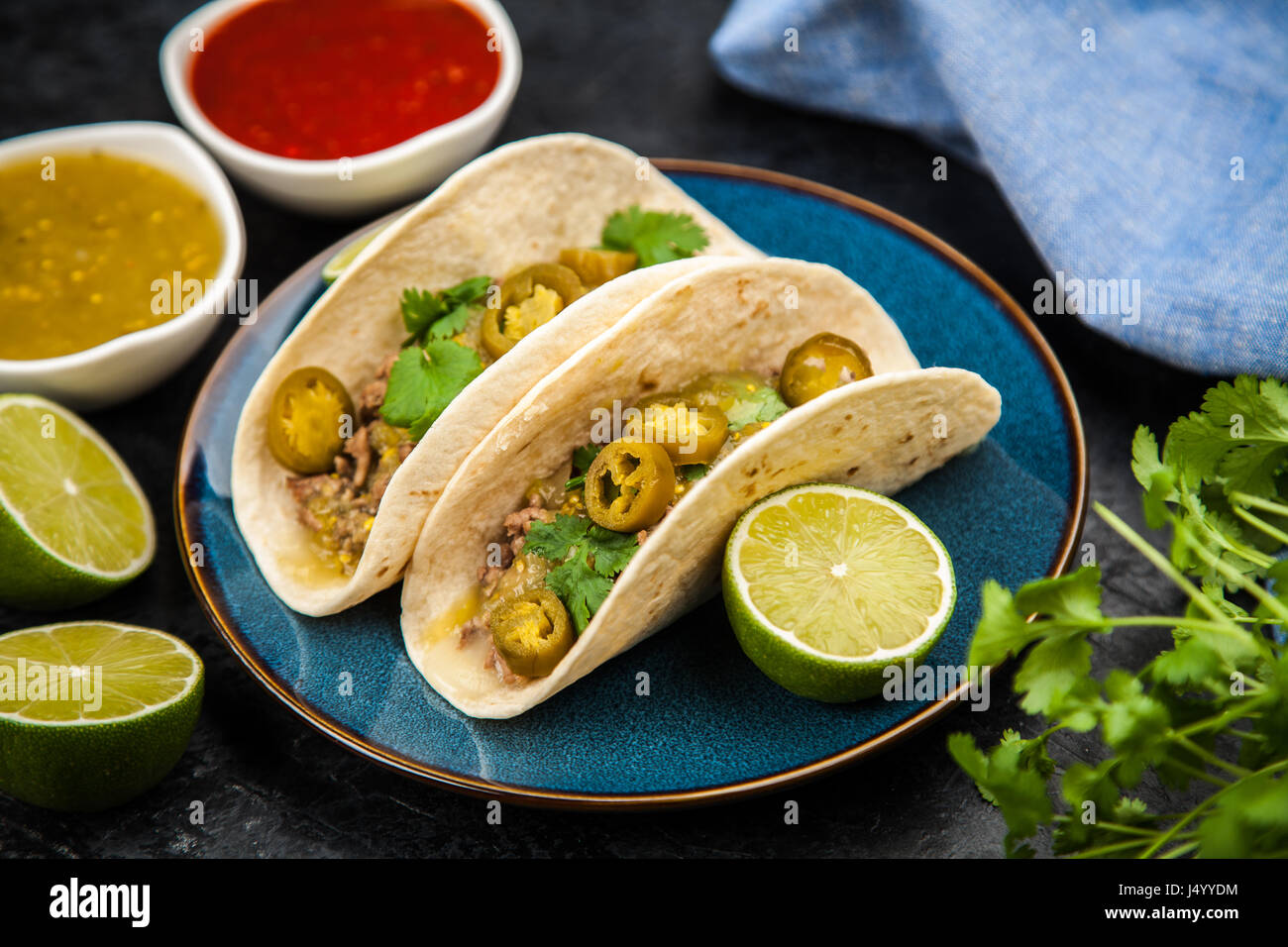 Mexican tacos with beef and green salsa Stock Photo - Alamy