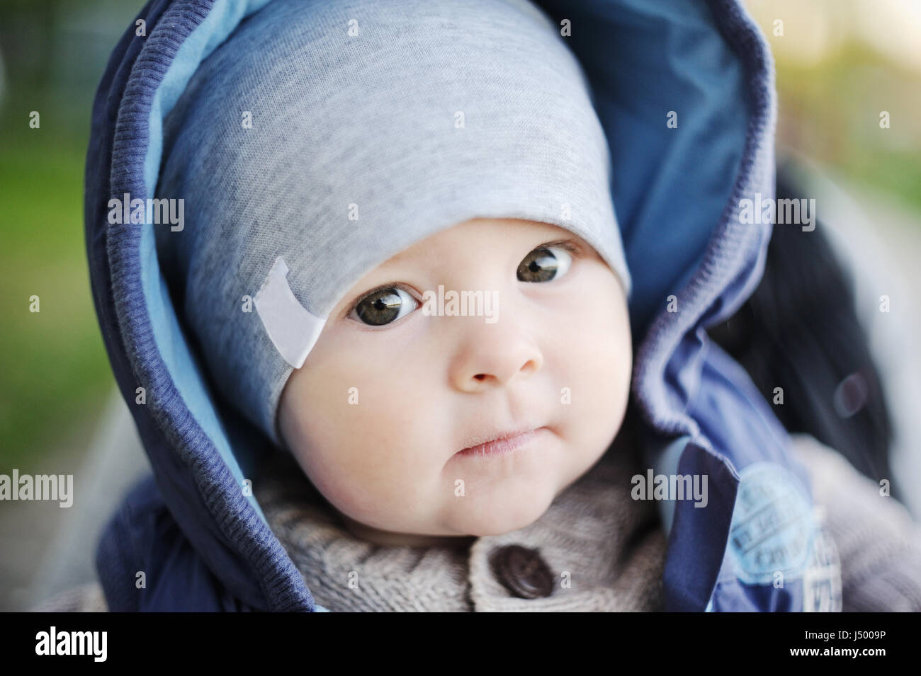portrait of a cute kid in the hood Stock Photo - Alamy