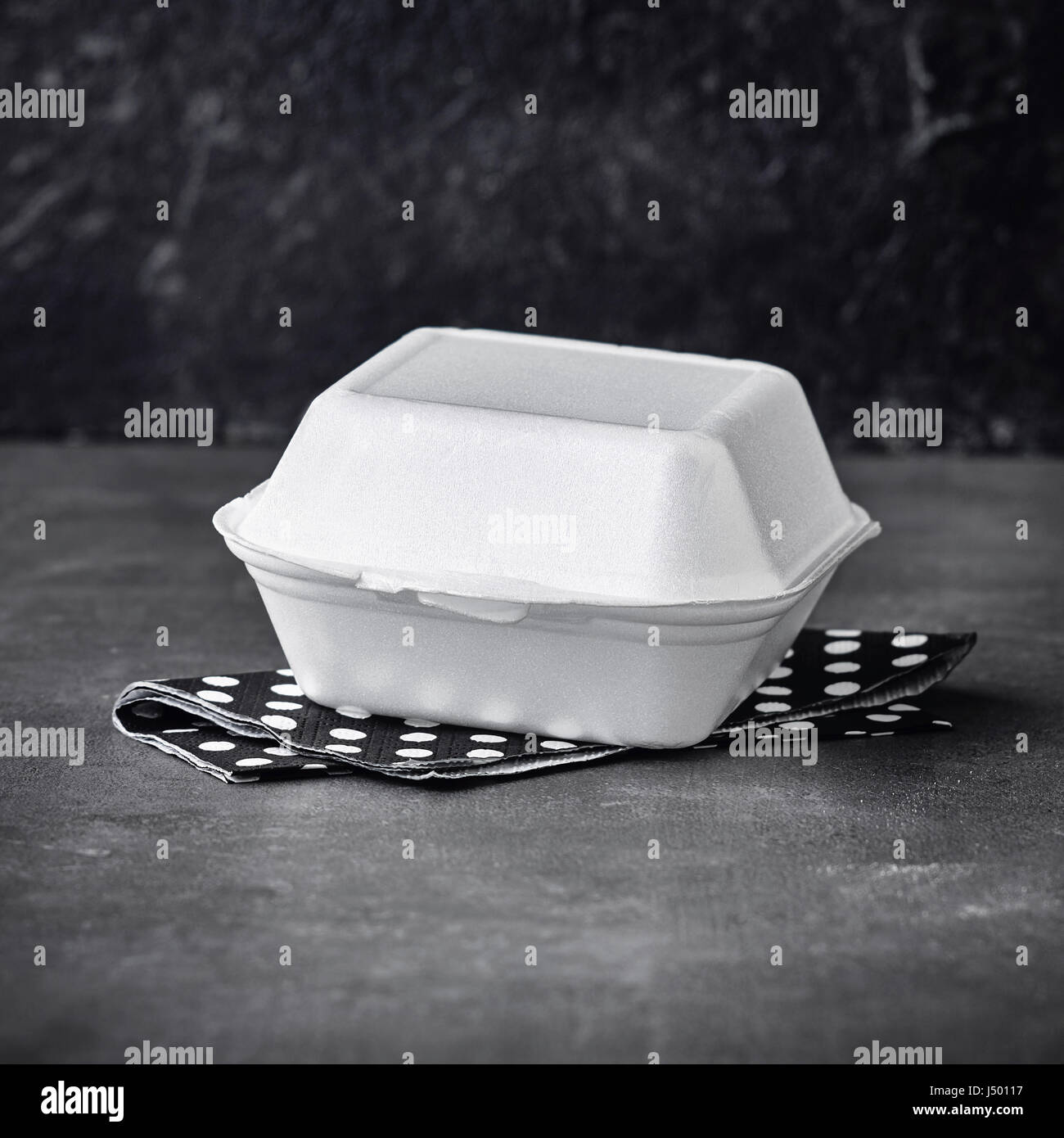 Styrofoam burger box on dotted napkin Stock Photo - Alamy