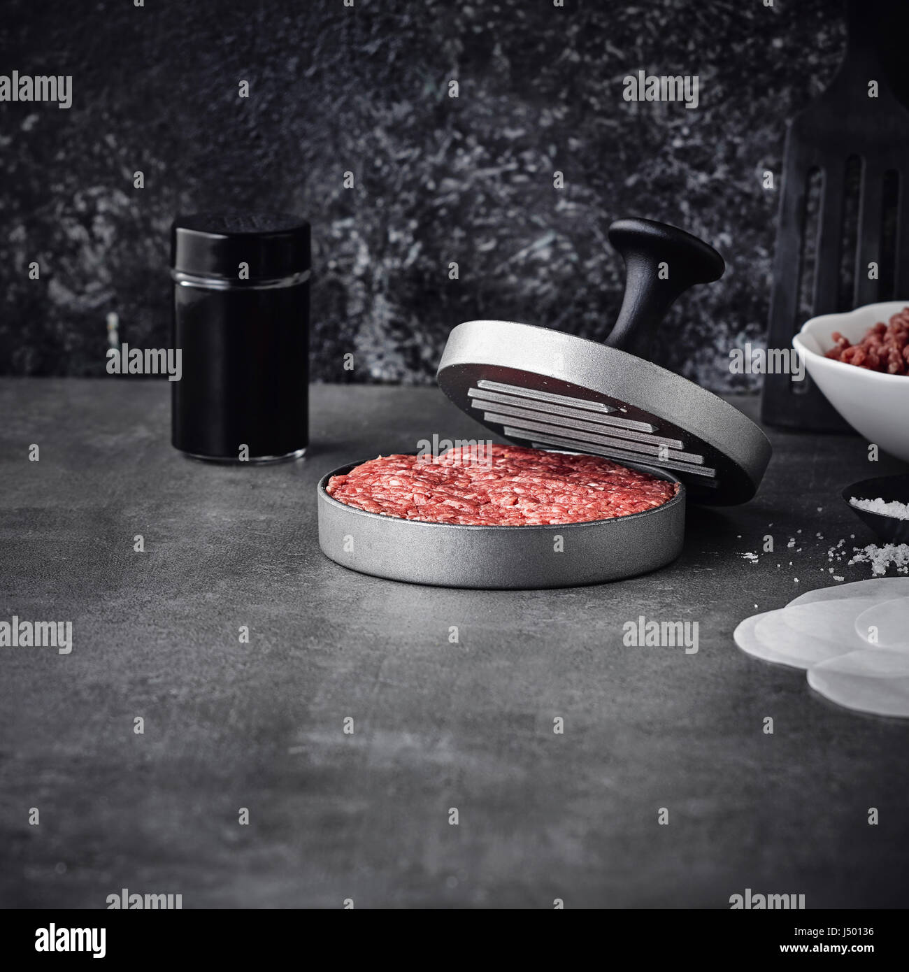 Hamburger press with freshly pressed burger patty Stock Photo - Alamy