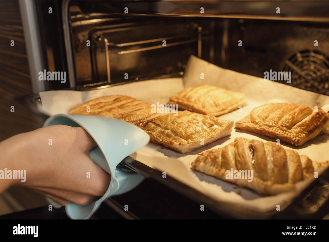 tasty cakes baking in the oven Stock Photo - Alamy