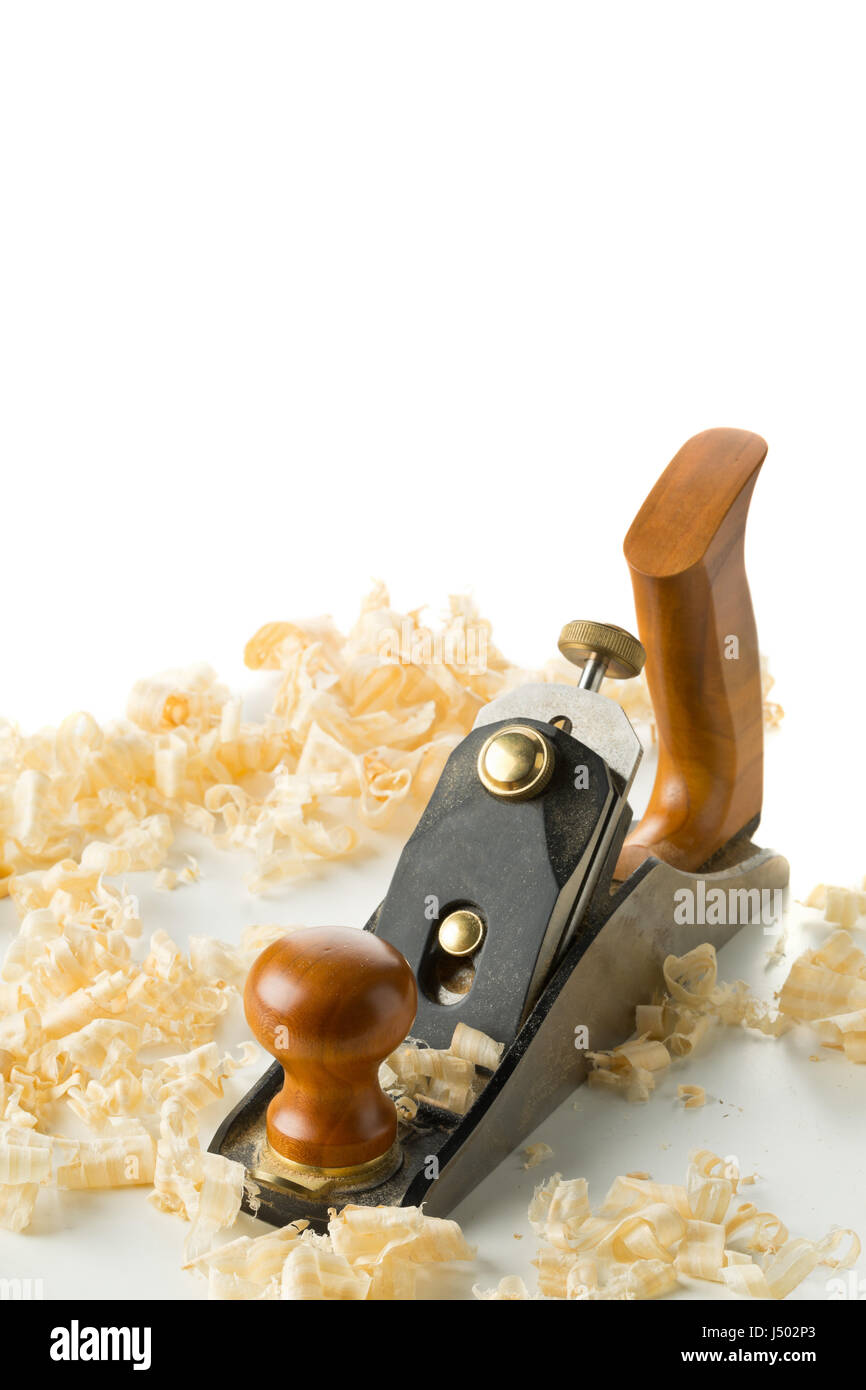 Woodworking hand planer tool on wooden boards in carpenter's workshop ...