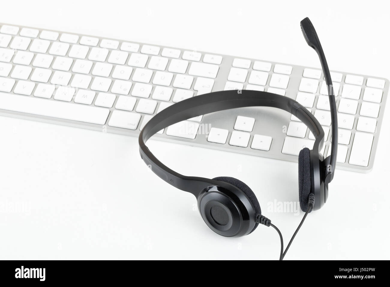 Office desk headset keyboard Cut Out Stock Images & Pictures - Alamy