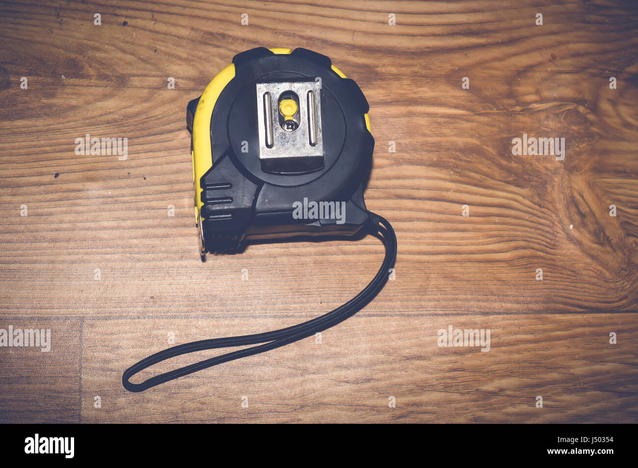 top view of tape measure on wooden table Stock Photo - Alamy