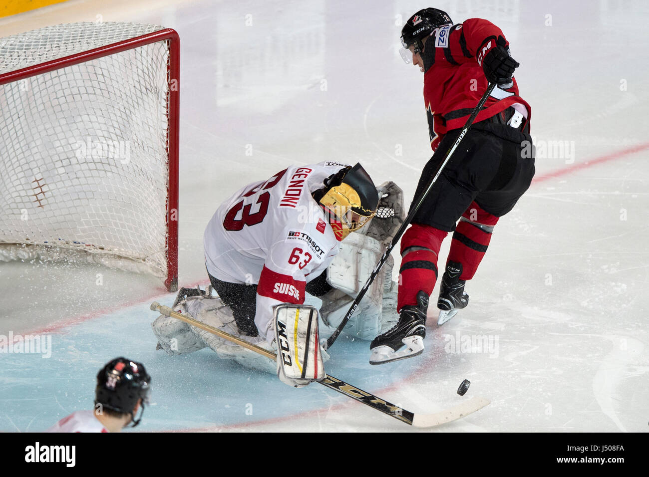 L-R Swiss goalie LEONARDO GENONI and NATHAN MACKINNON of Canada in ...