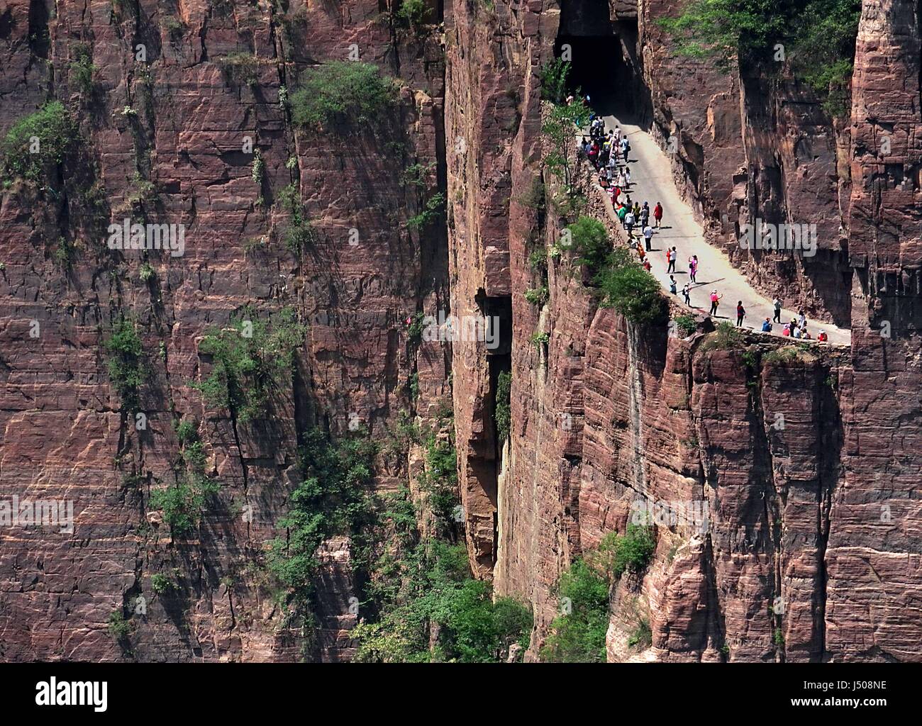 Zhengzhou, China's Henan Province. 13th May, 2017. Tourists walk on the ...