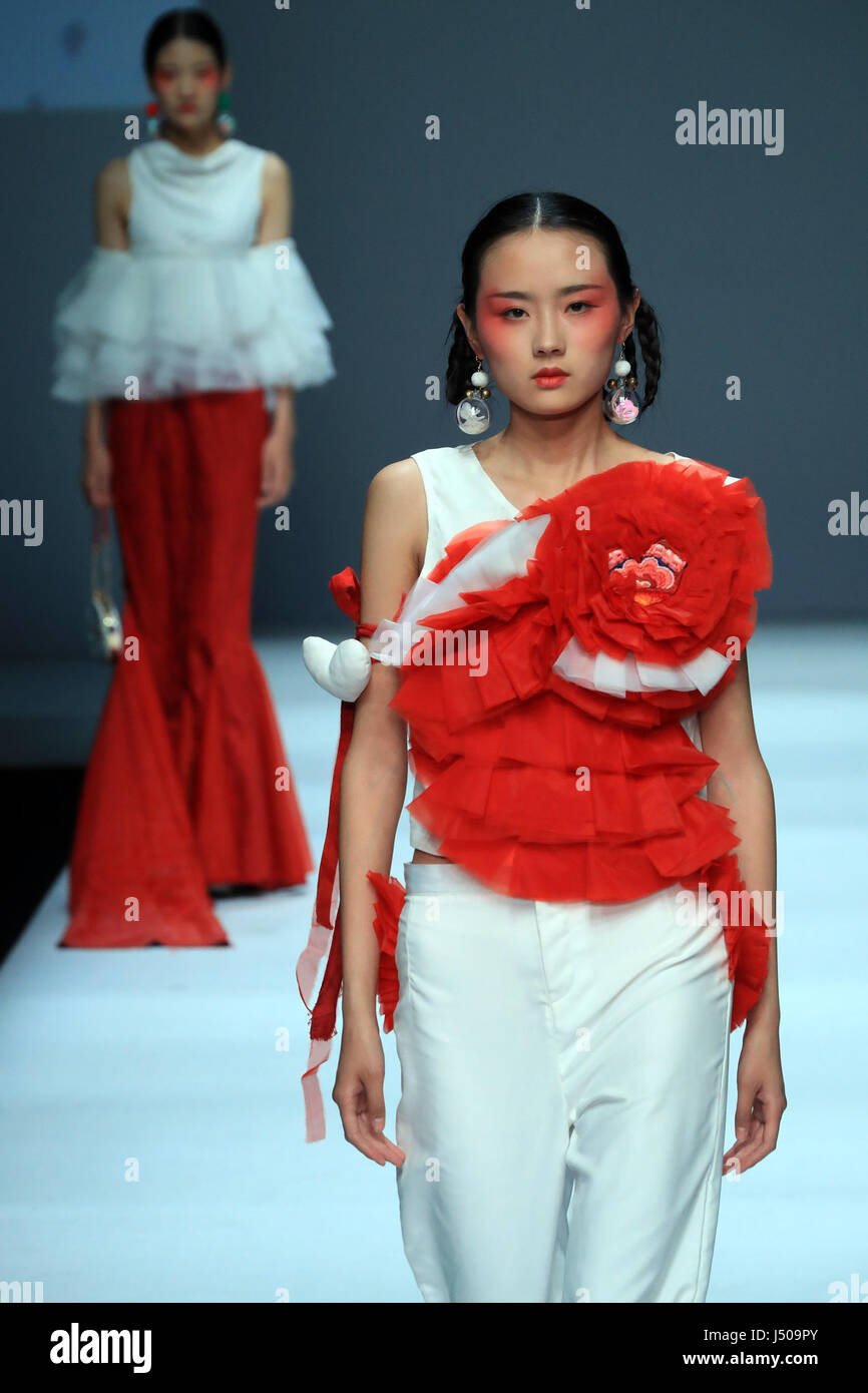 Beijing, China. 15th May, 2017. Models present creations designed by ...