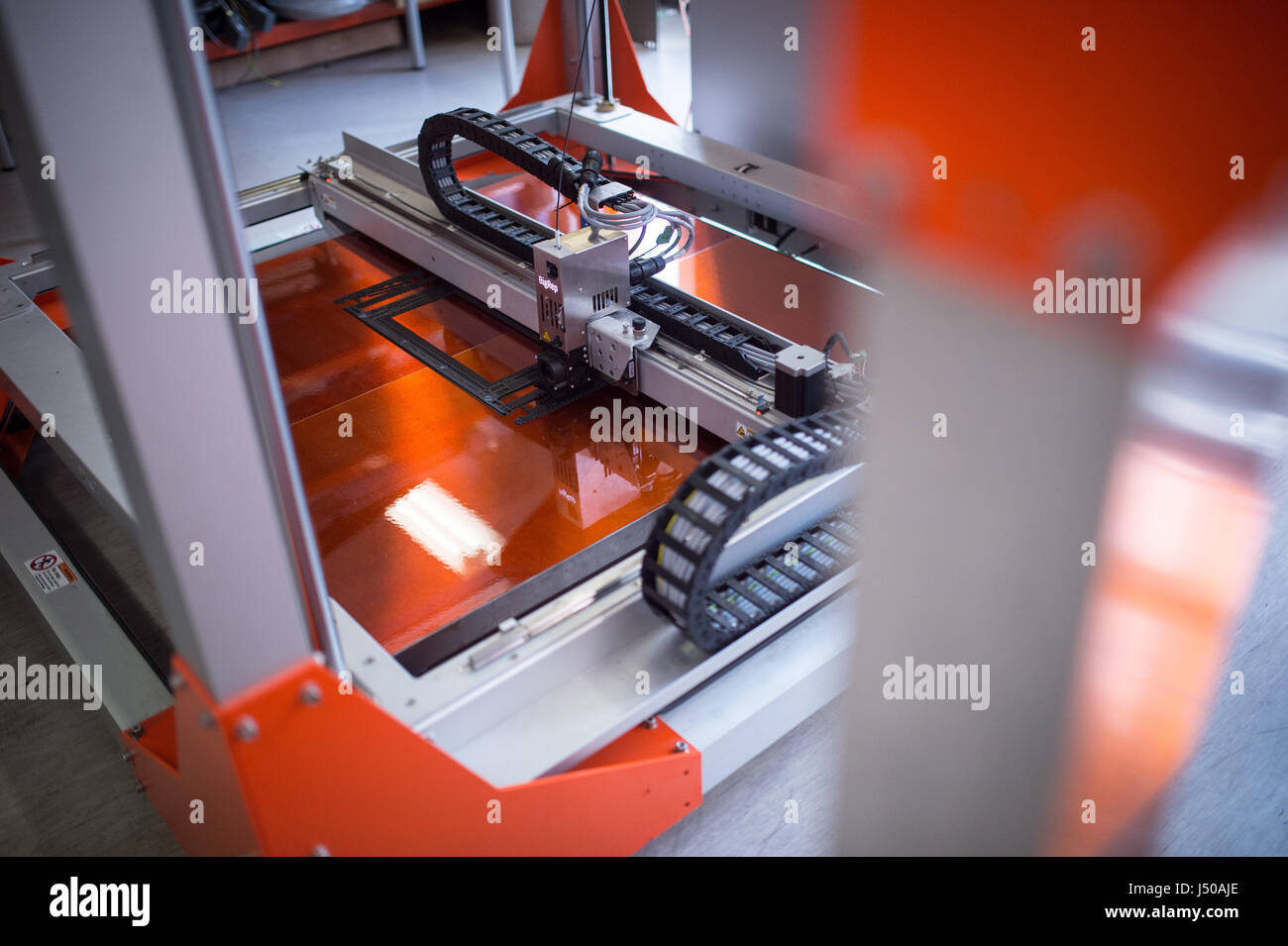 Berlin, Germany. 15th May, 2017. A 3D Printer produces a model in ...