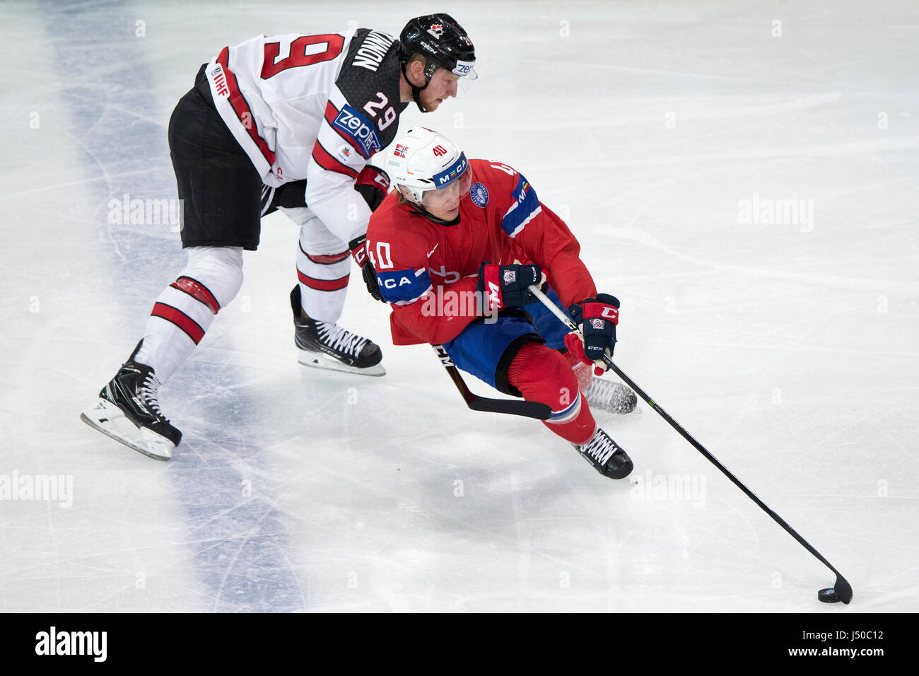 From left: Nate MacKinnon of Canada and Ken Andre Olimb of Norway in ...