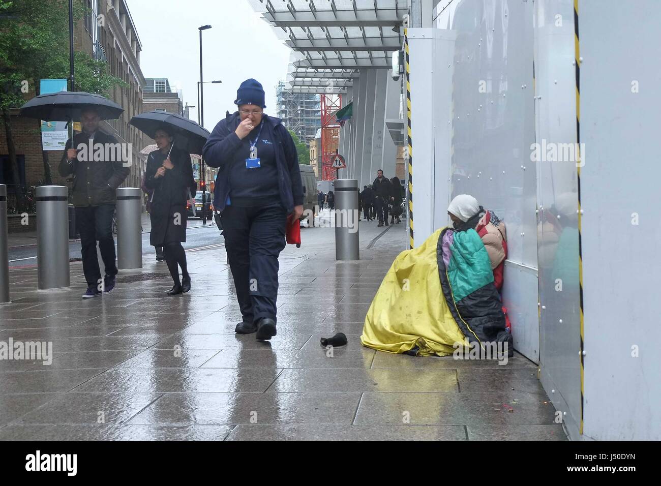 London, UK. 15th May, 2017. Homeless man next to The Shard at London ...