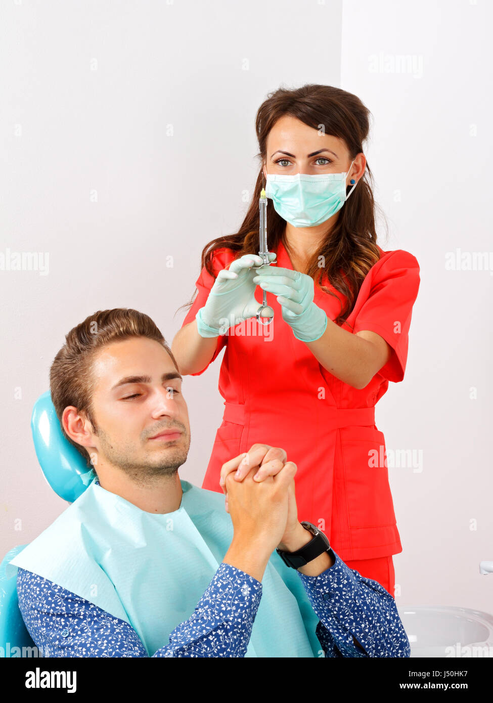 Scared dental patient receiving anesthesia injection Stock Photo - Alamy