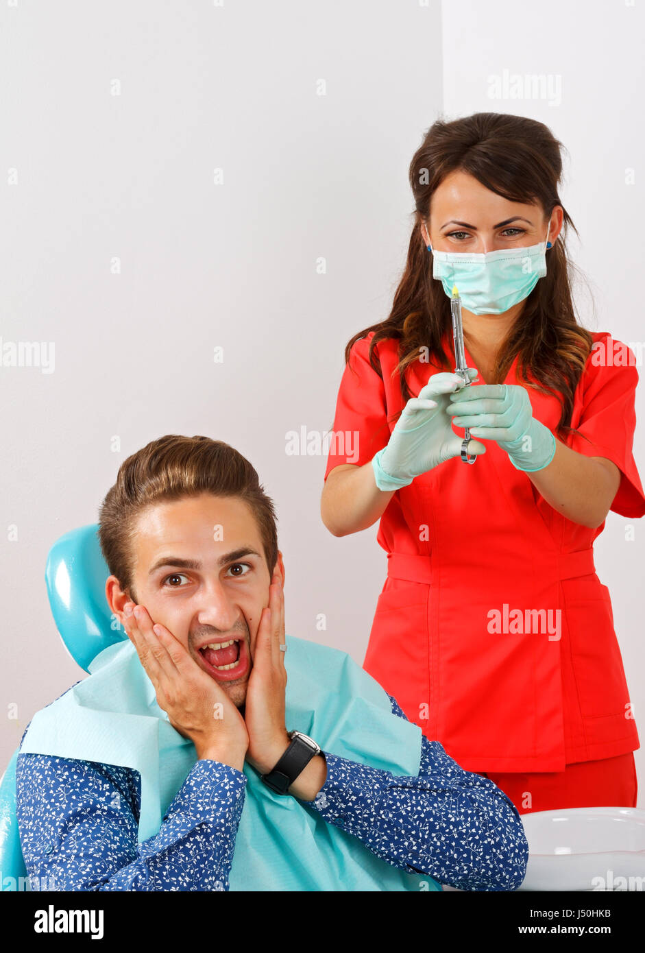 Scared dental patient receiving anesthesia injection Stock Photo - Alamy