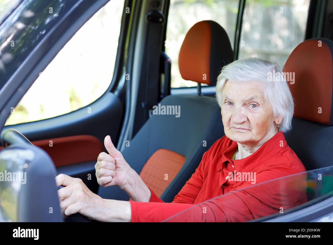 Picture of a confident senior woman driving a car Stock Photo - Alamy
