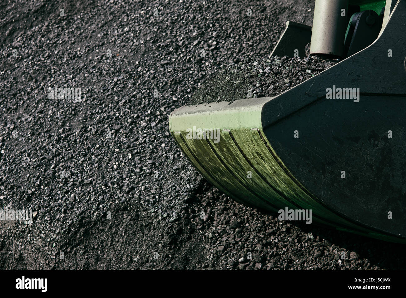 Coal loading excavator, heaps of coal Stock Photo - Alamy