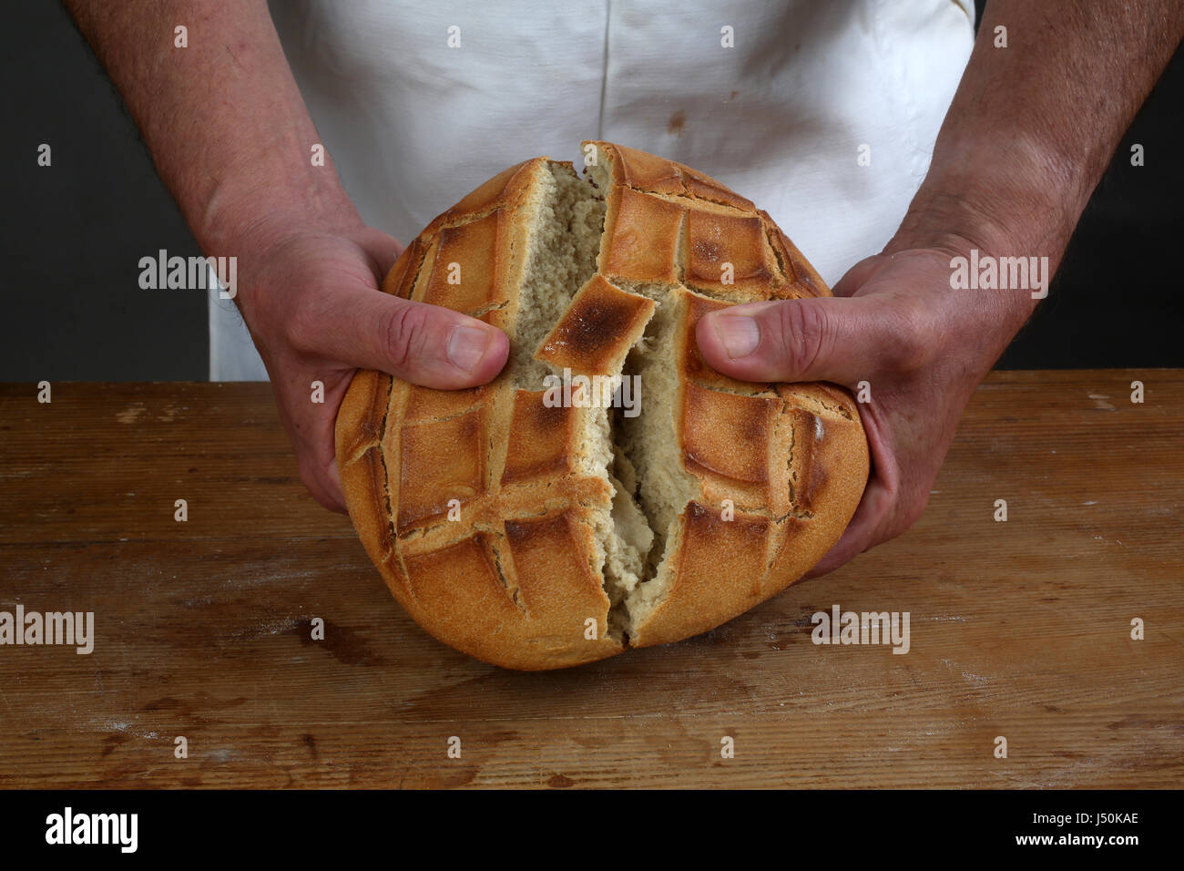 Breaking of a fresh loaf of Eucharistic bread in Zagreb, Croatia on ...